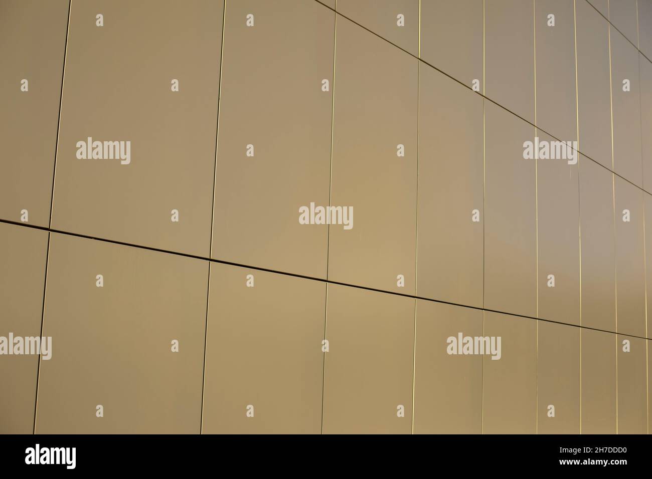 Wall of facing panels. The white wall of the shopping center. Details ...