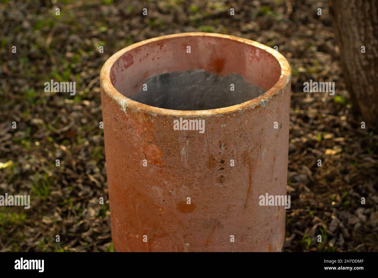Stone garbage bin. Concrete cylinder for waste. Park object for garbage ...
