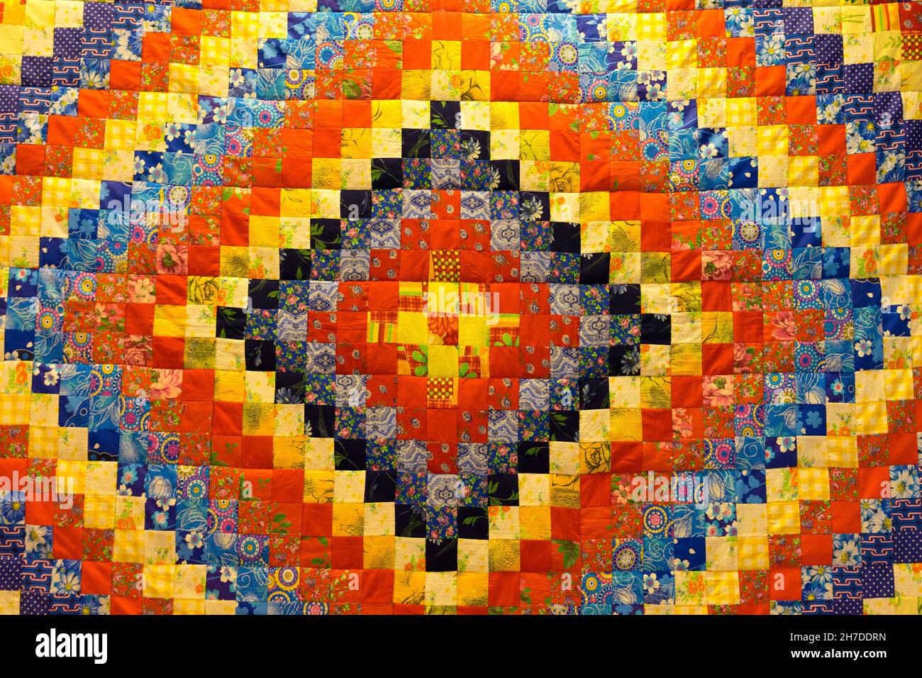 mottled background in patchwork fabrics of different colors Stock Photo ...