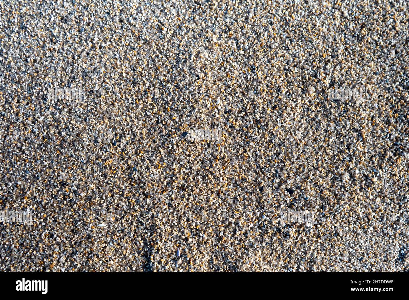 Natural background of multicolored coarse sand Stock Photo - Alamy