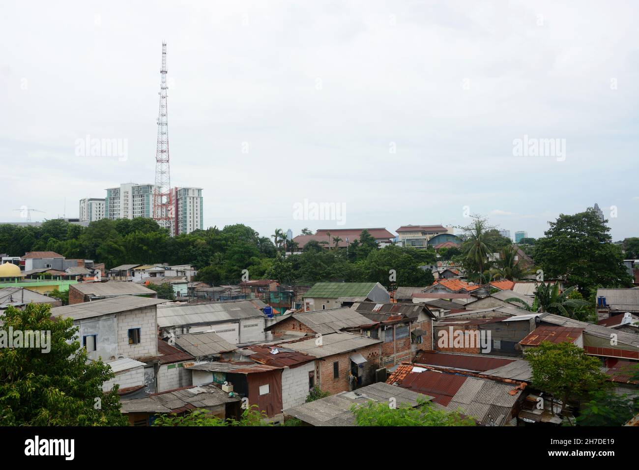residential areas in Jakarta which are located between large buildings ...