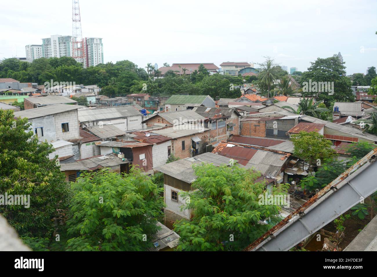 residential areas in Jakarta which are located between large buildings ...