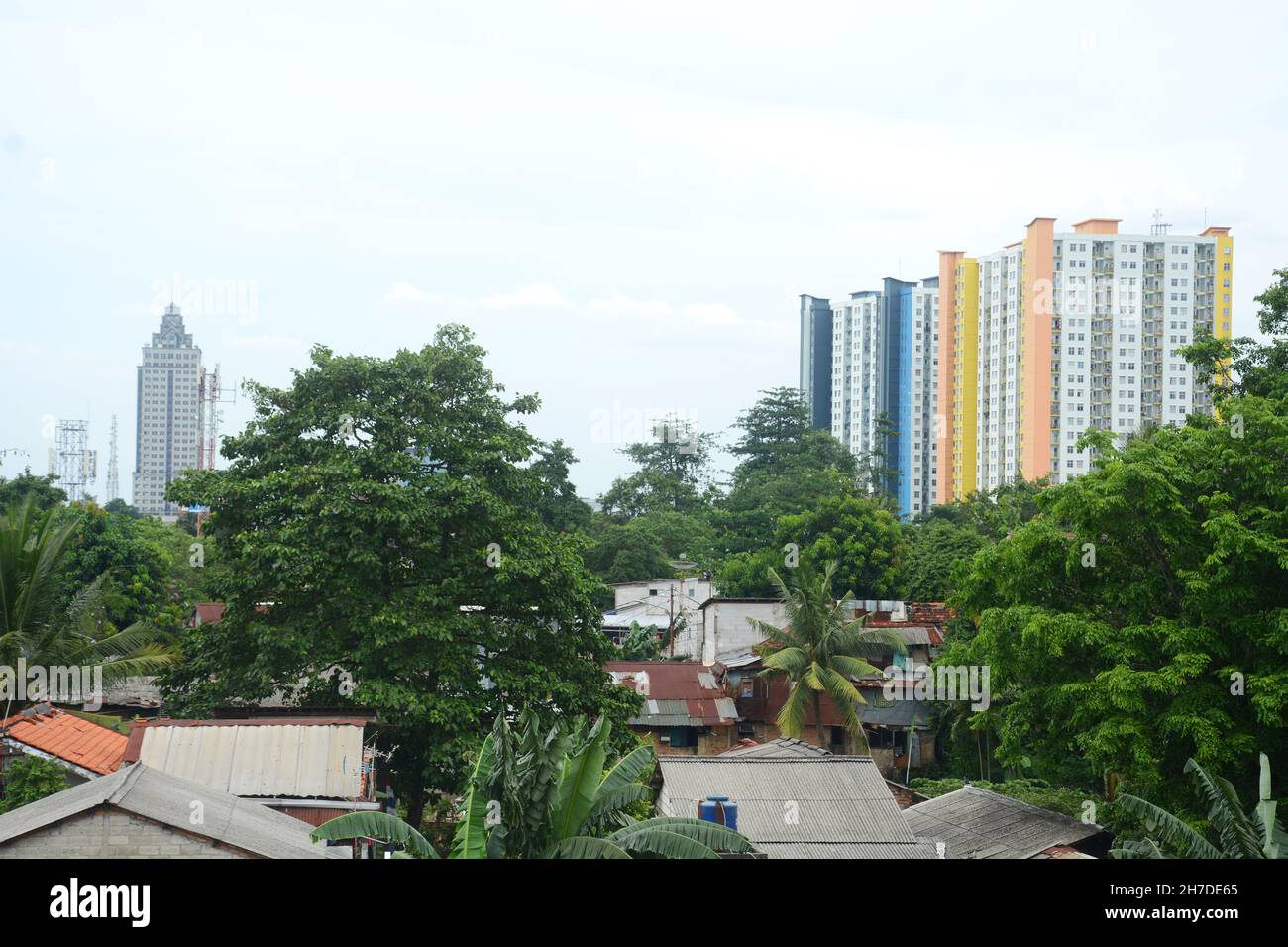 residential areas in Jakarta which are located between large buildings ...