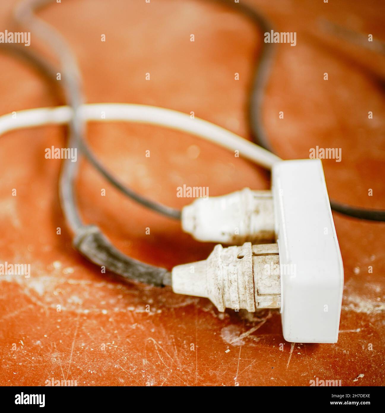 old homemade extension cord with wires on the floor Stock Photo - Alamy