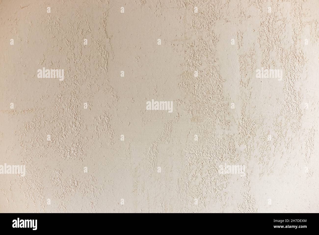 Pale beige matt plaster wall close-up. Decorative Venetian plaster ...