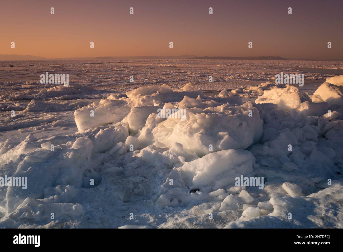 The natural landscape with the icy surface of the sea Stock Photo - Alamy