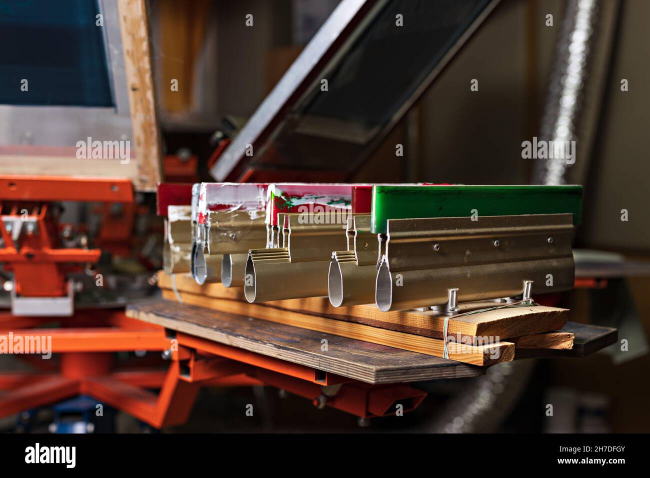 serigraphy production. squeegees on wooden shelve of the print ...