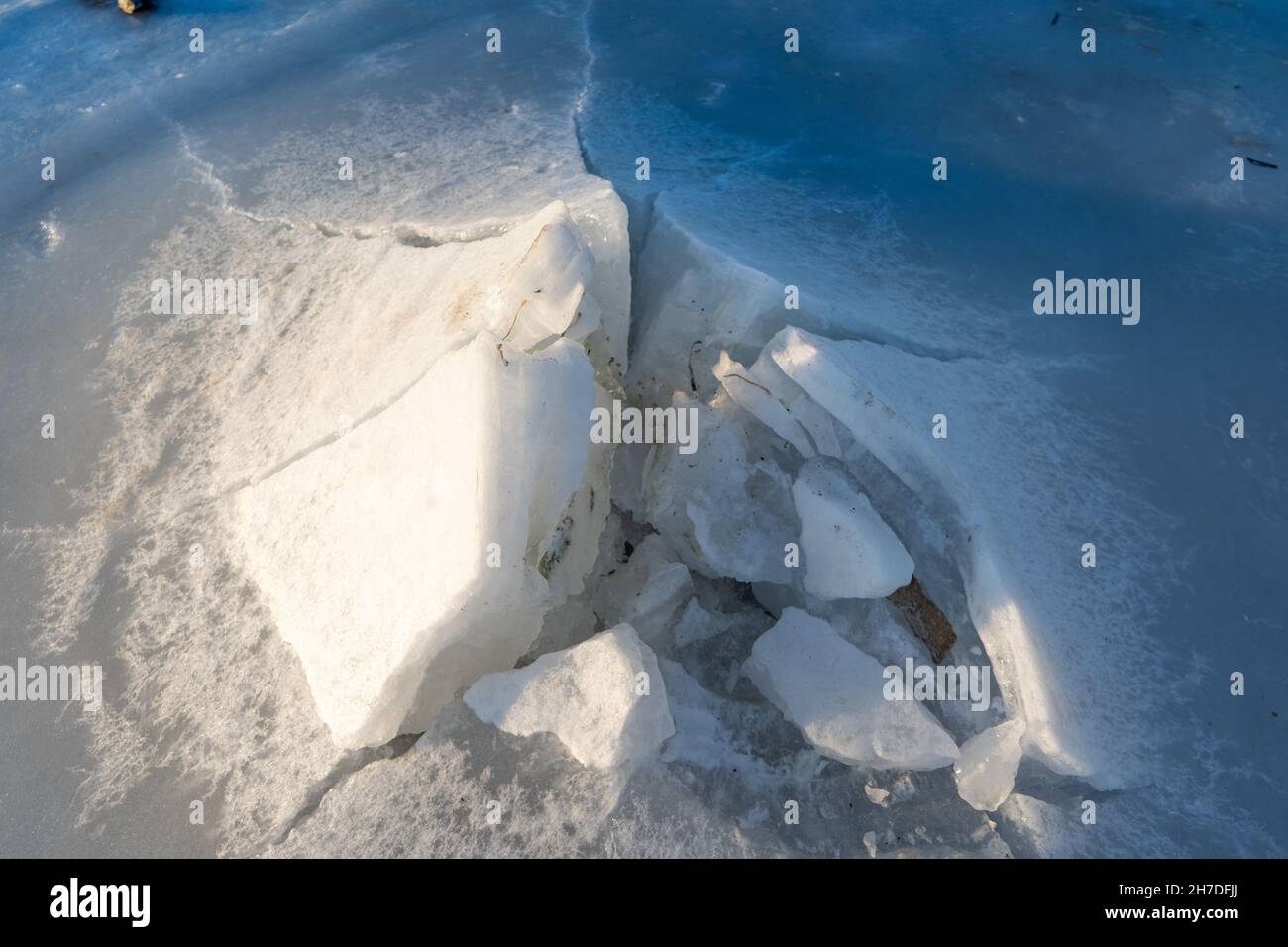White ice background with cracks and bloating Stock Photo - Alamy