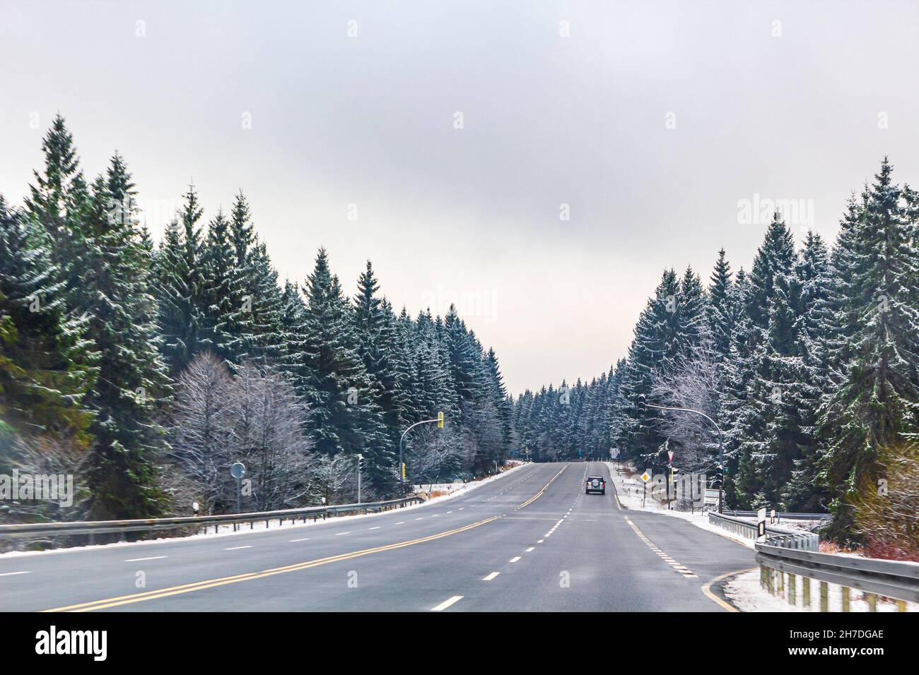 Road street between icy plants trees and landscape in Harz mountains ...
