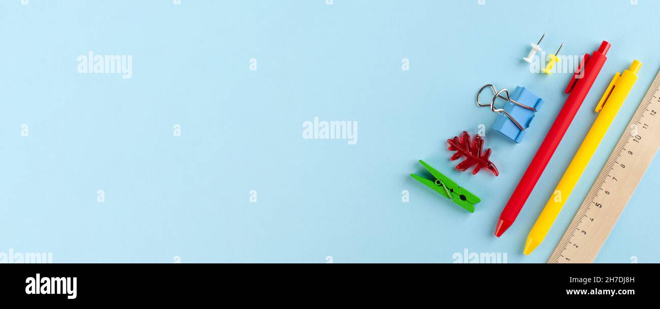 Frame of school stationery on gentle light blue background banner for ...