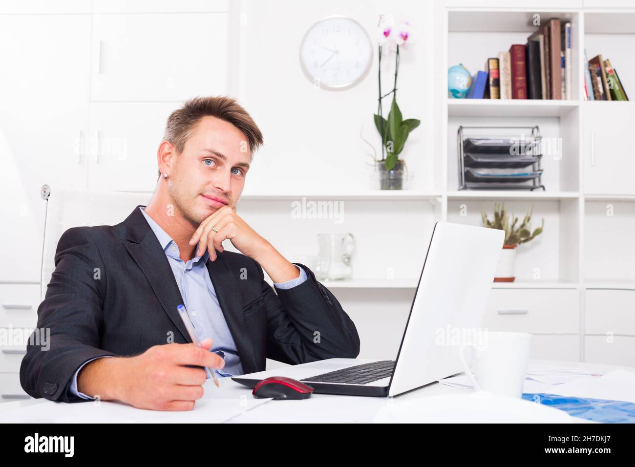 Cheerful male employee holding hi-res stock photography and images - Alamy