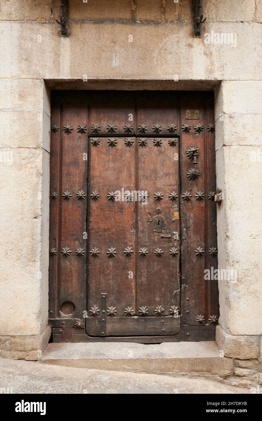 Stone wall with old entrance and wooden door Stock Photo - Alamy