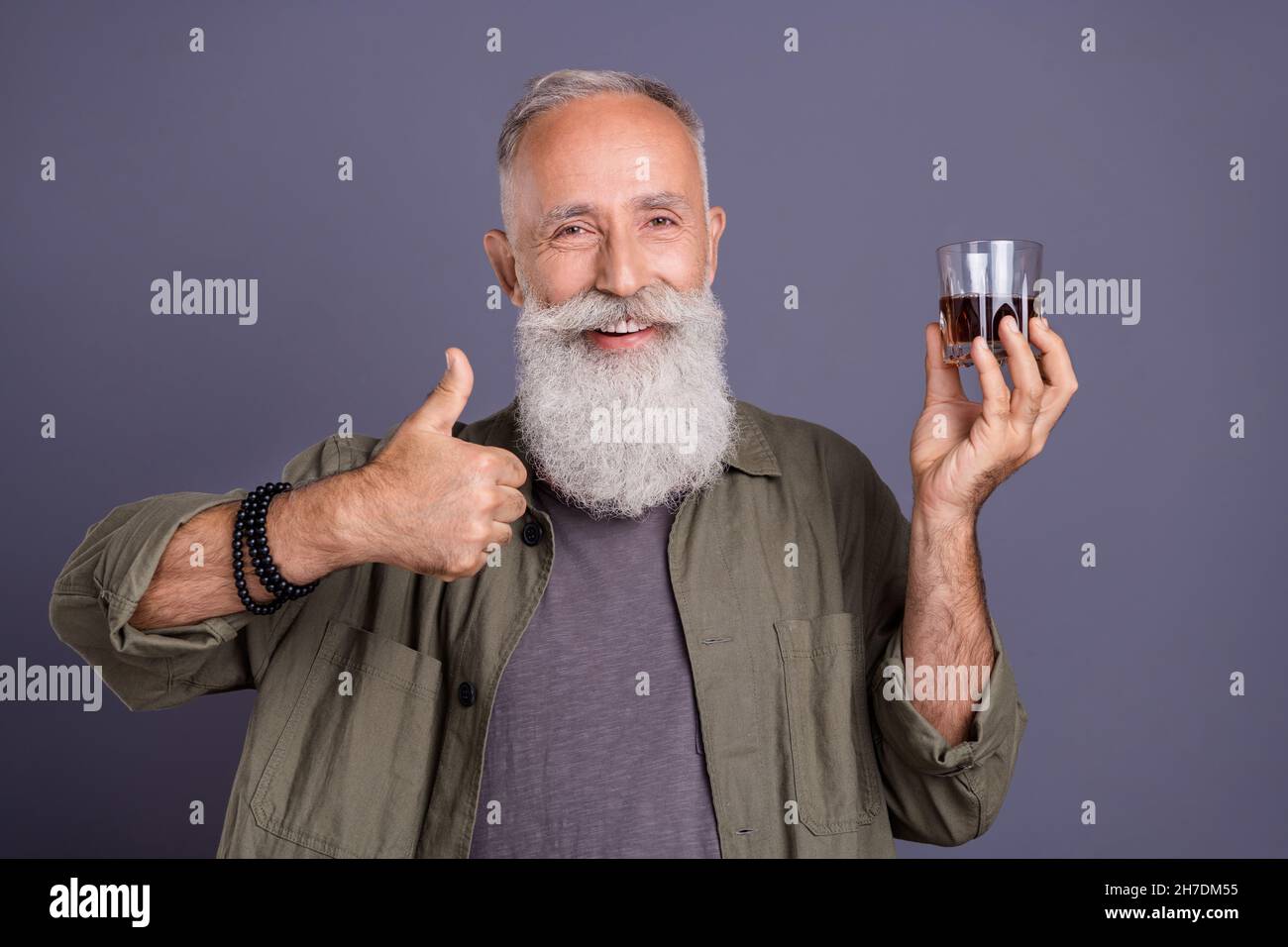 Photo of retired rich man show thumb-up approve perfect quality scotch ...