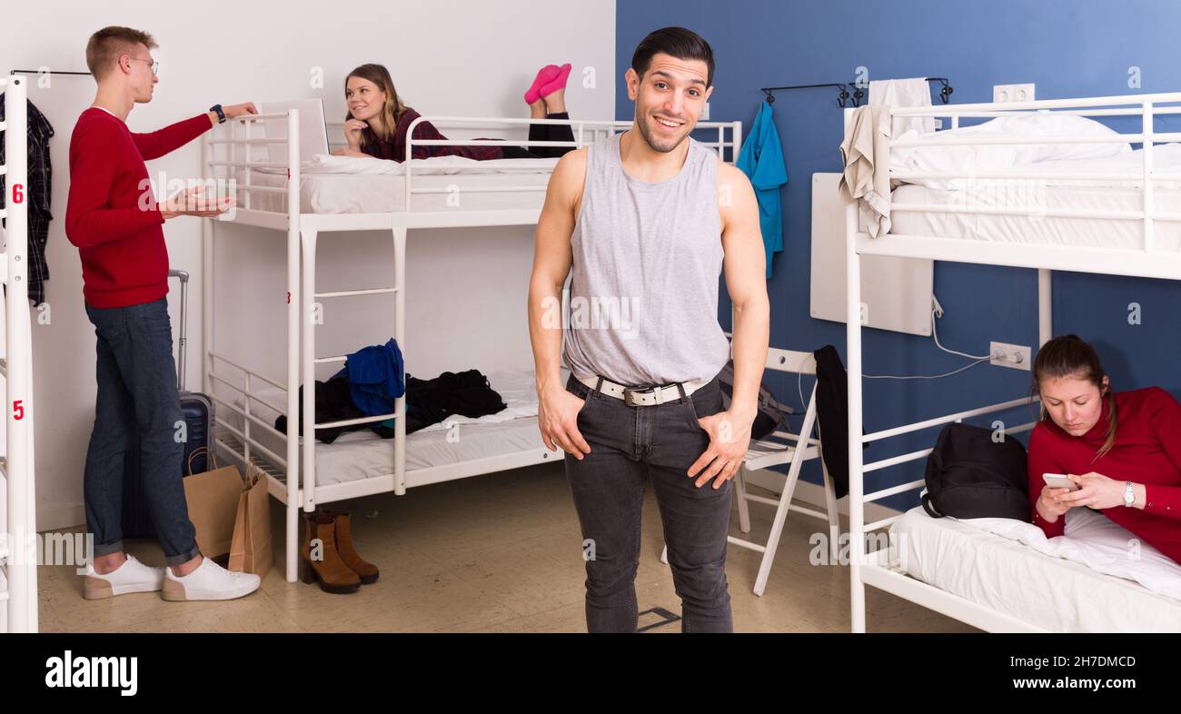 Man in bedroom of hostel Stock Photo - Alamy
