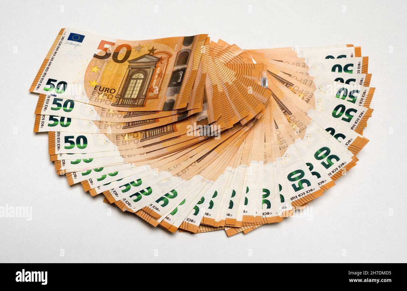 Fifty euro banknotes lie as fan on white background Stock Photo - Alamy
