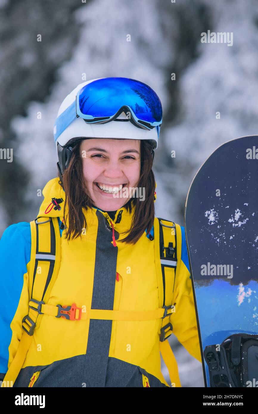 pretty woman snowboarder portrait winter activities Stock Photo - Alamy