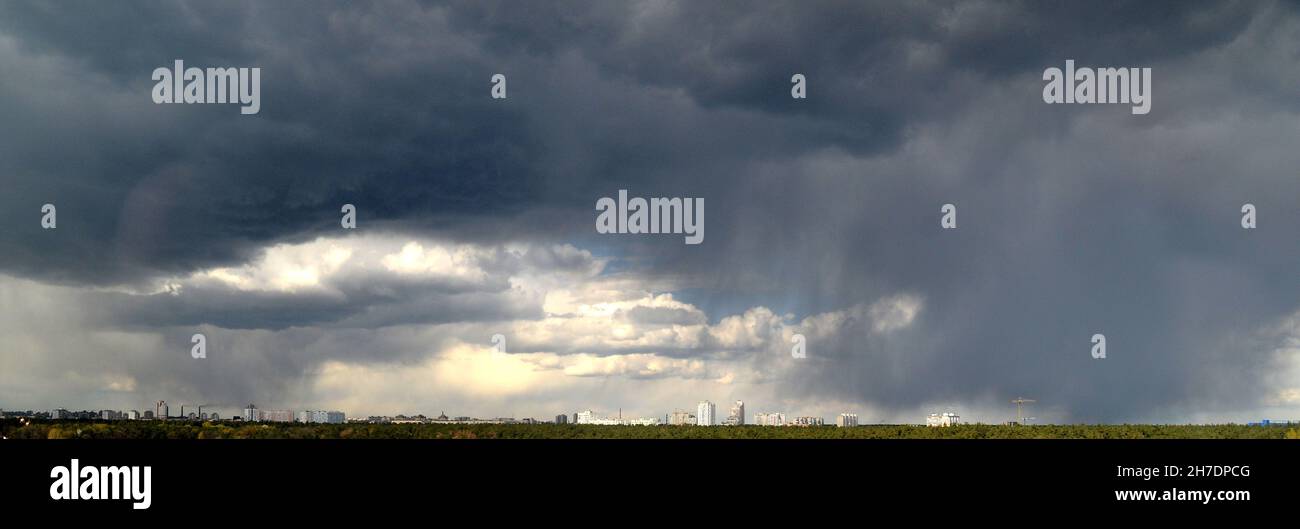 Storm over modern city, panoramic view. Rain clouds, natural storm ...