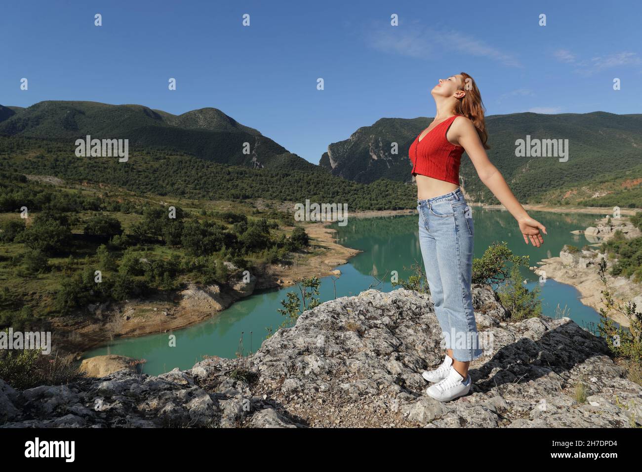 Woman relaxing breathing fresh air in a lake on summer vacation Stock ...