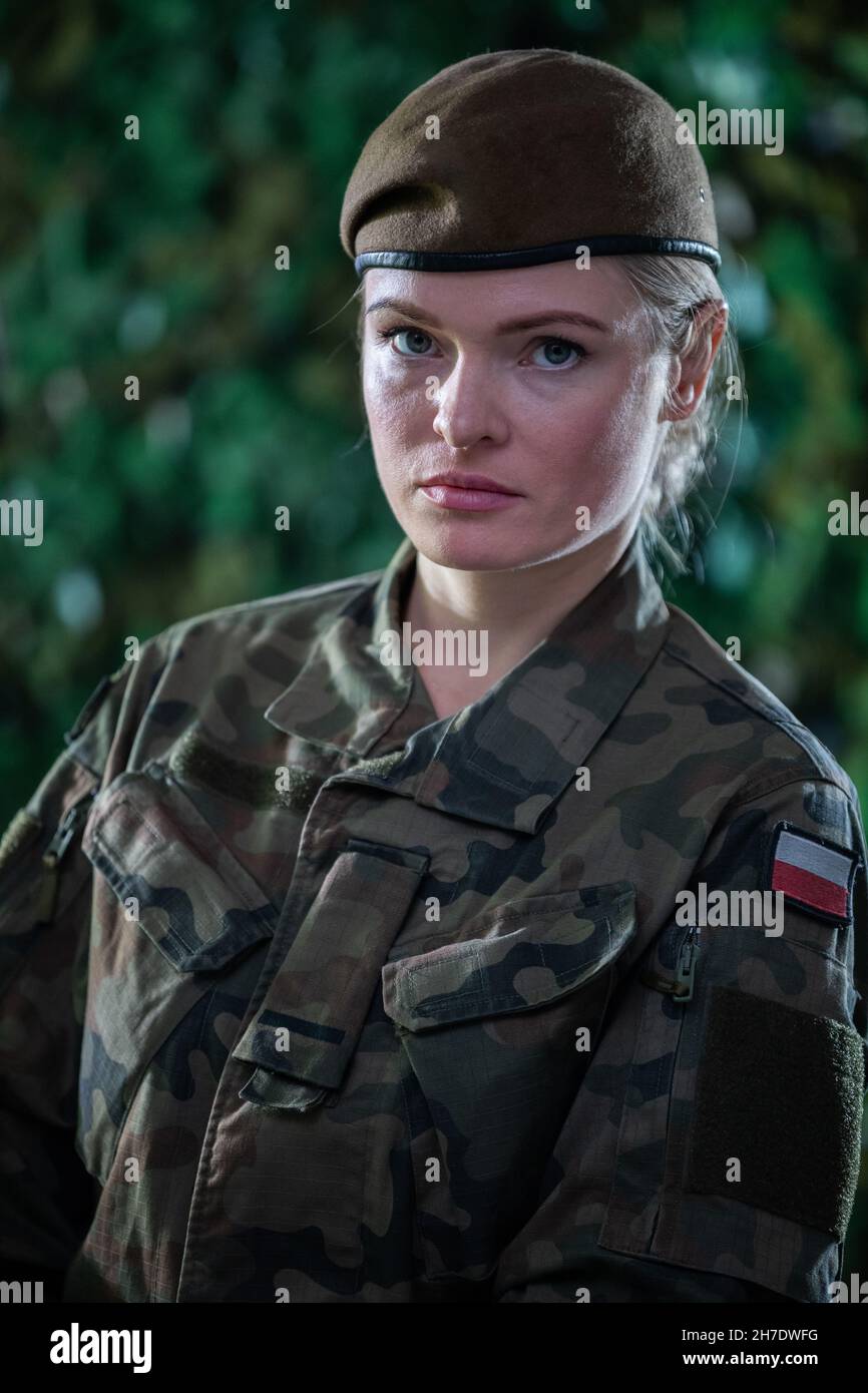 Portrait Of A Young Lady Soldier In Military Clothing While On Duty ...