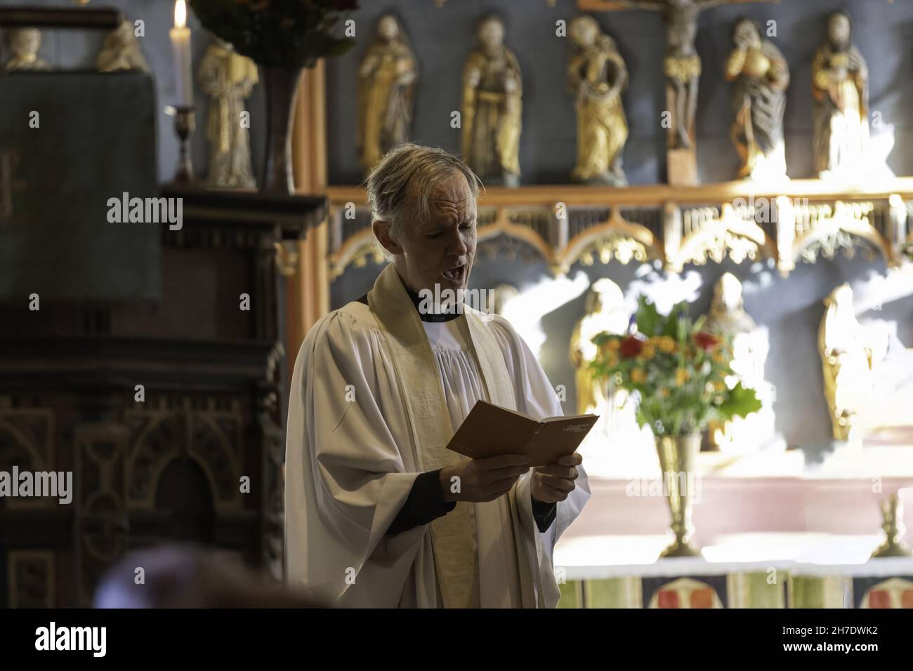MOTALA, SWEDEN - Oct 17, 2021: A priest singing psalms from the Bible ...