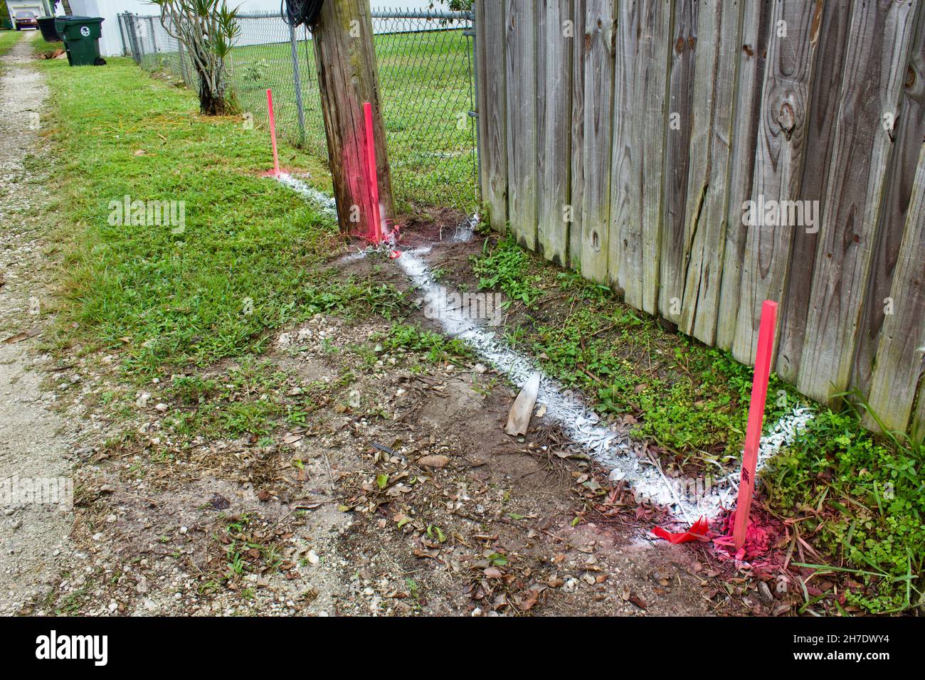 Utility easement outlined and staked on residential property Stock ...