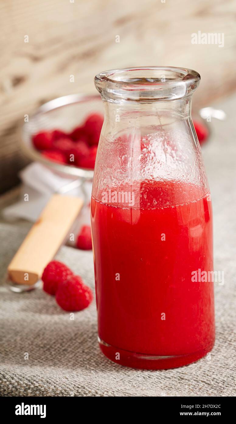 Homemade raspberry liqueur with vodka and raspberry spirit Stock Photo ...