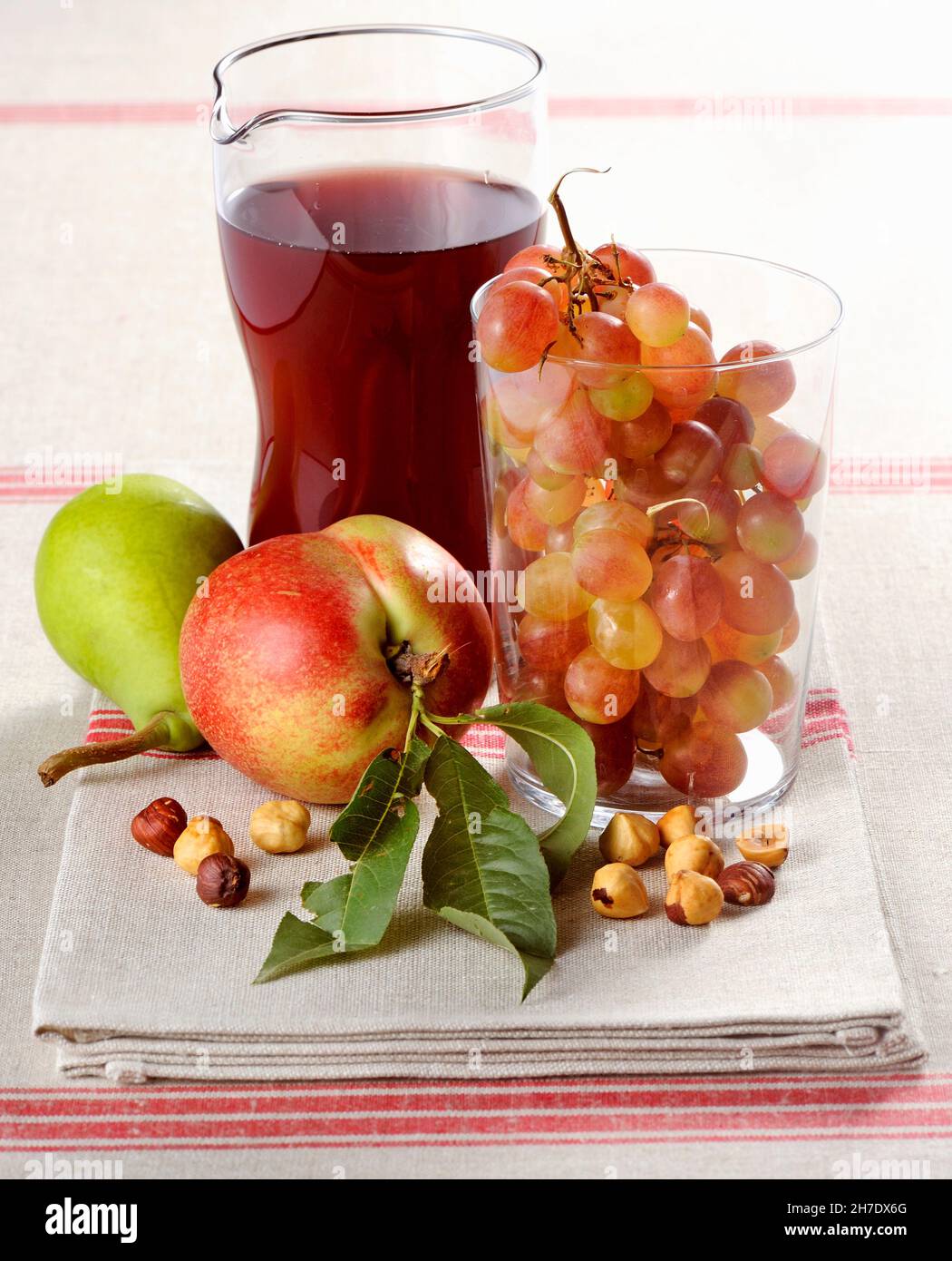 An arrangement of fresh fruit, hazelnuts and red wine Stock Photo - Alamy