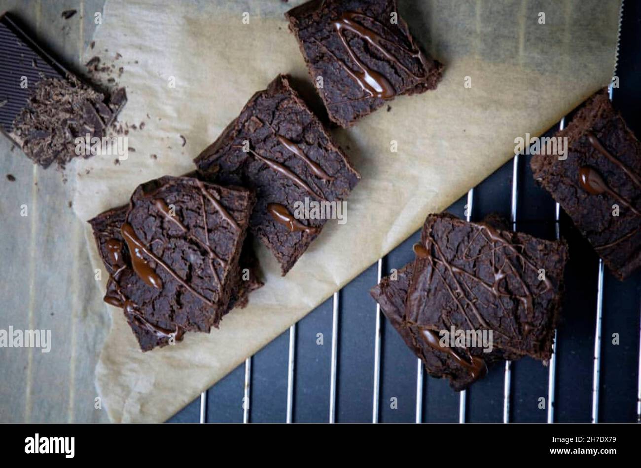 Chocolate brownies on baking paper Stock Photo - Alamy