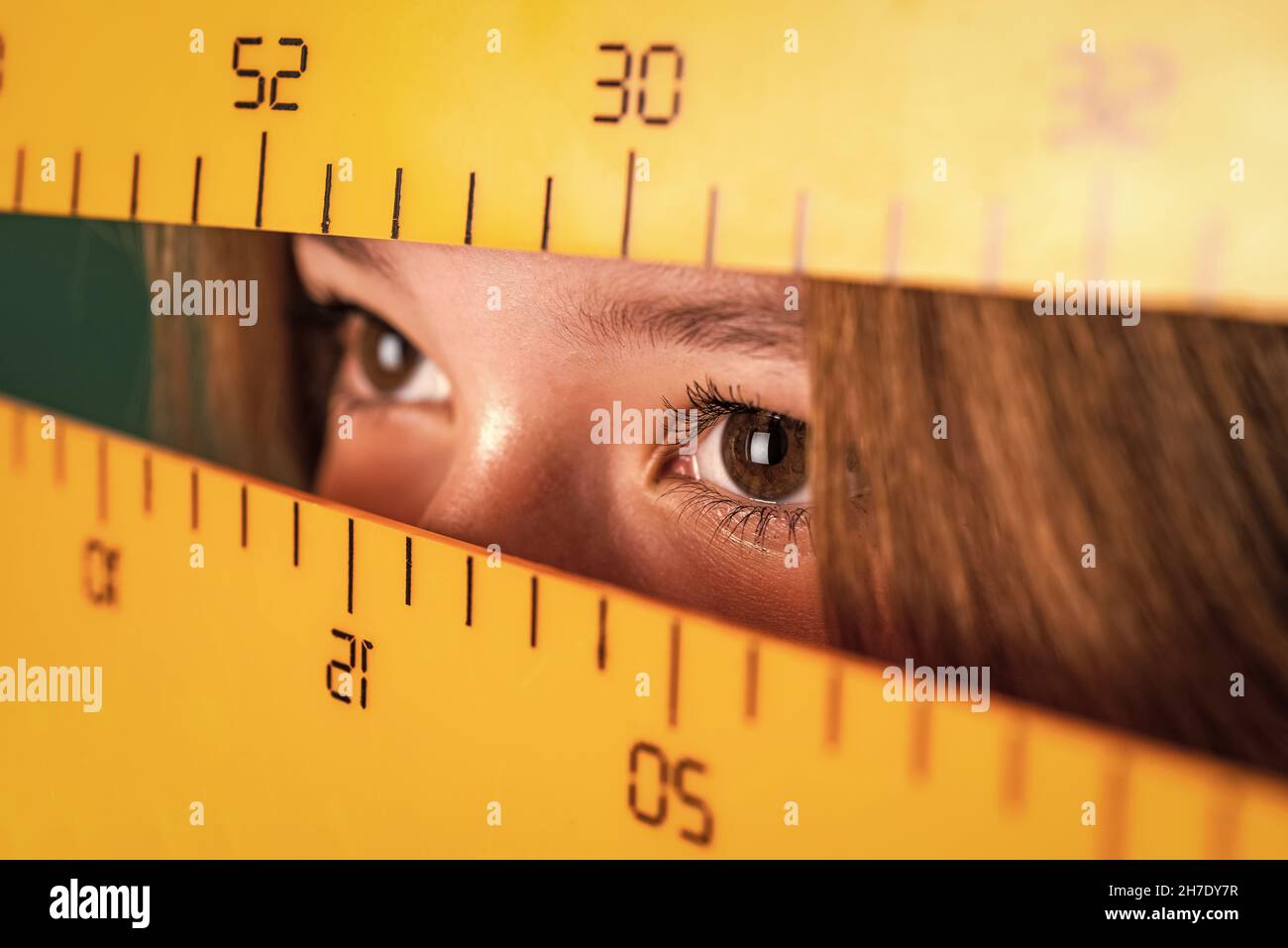 what angle you look. child pupil hold ruler. girl is college student ...