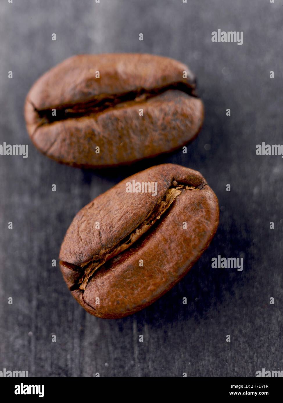 Coffee beans on a grey background Stock Photo - Alamy