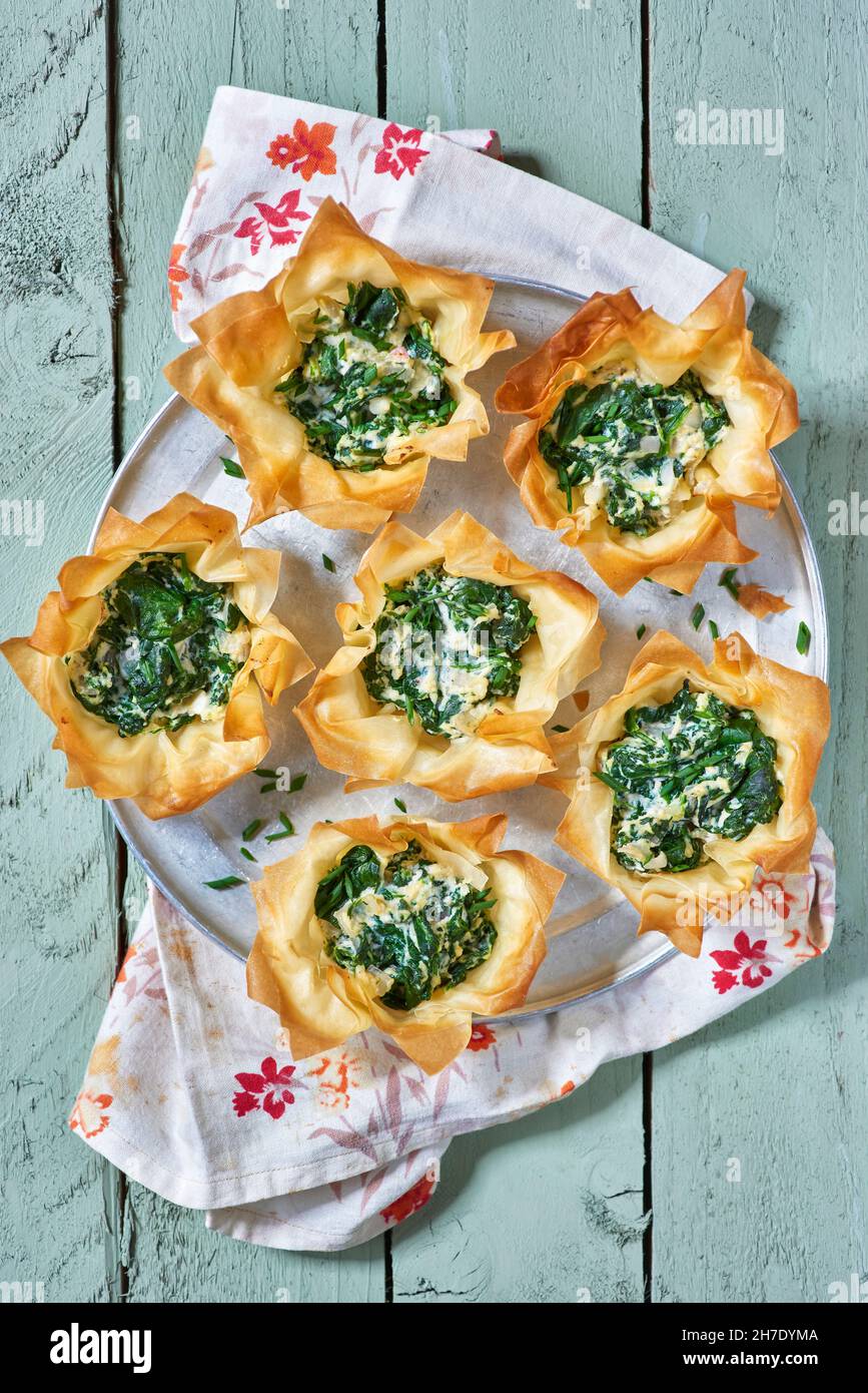 Spanakopita mini pies Stock Photo - Alamy