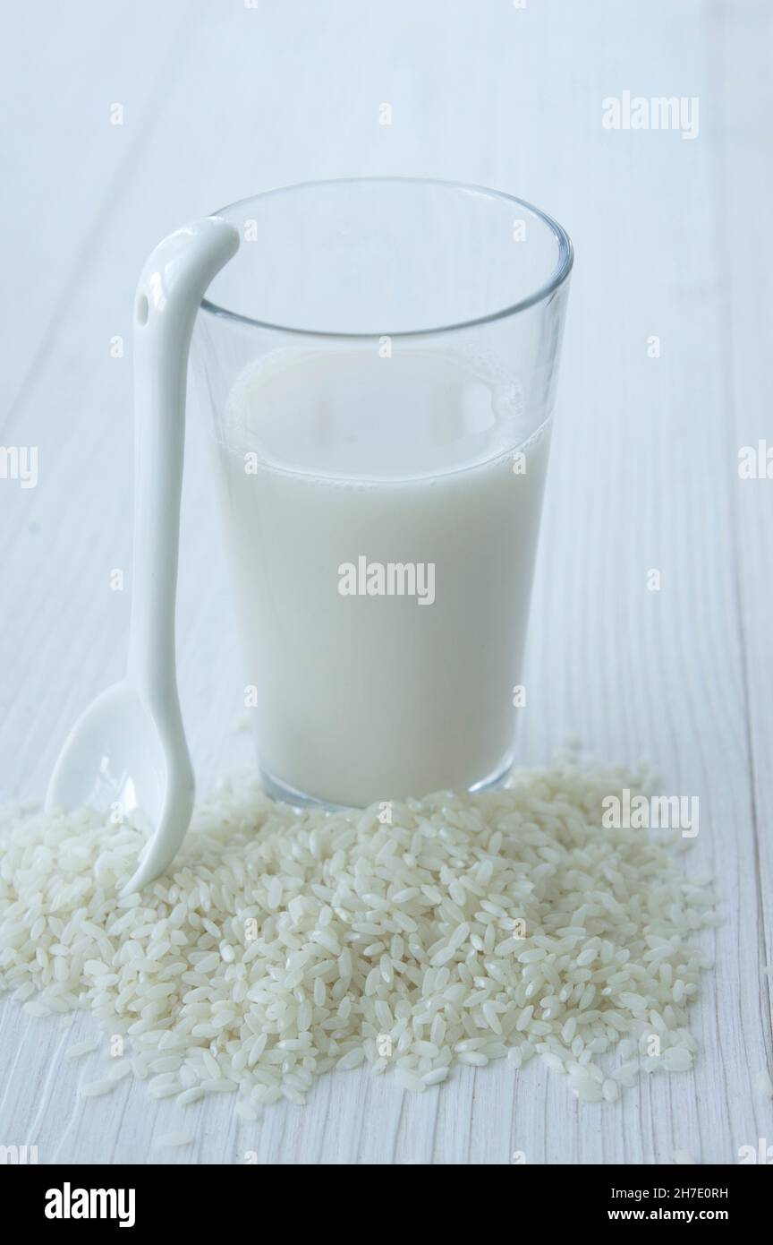 Rice milk in a glass and rice Stock Photo - Alamy