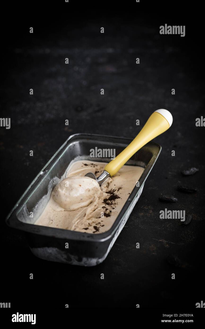 Tonka bean ice cream in a tray, with and ice cream scoop and tonka ...