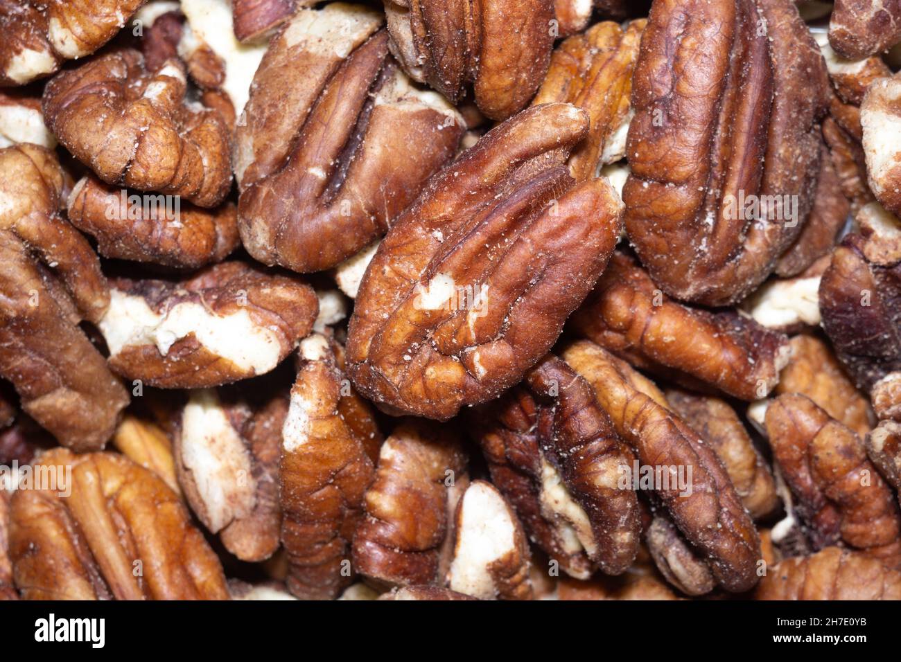 Peeled fresh pecan nuts close up background Stock Photo - Alamy