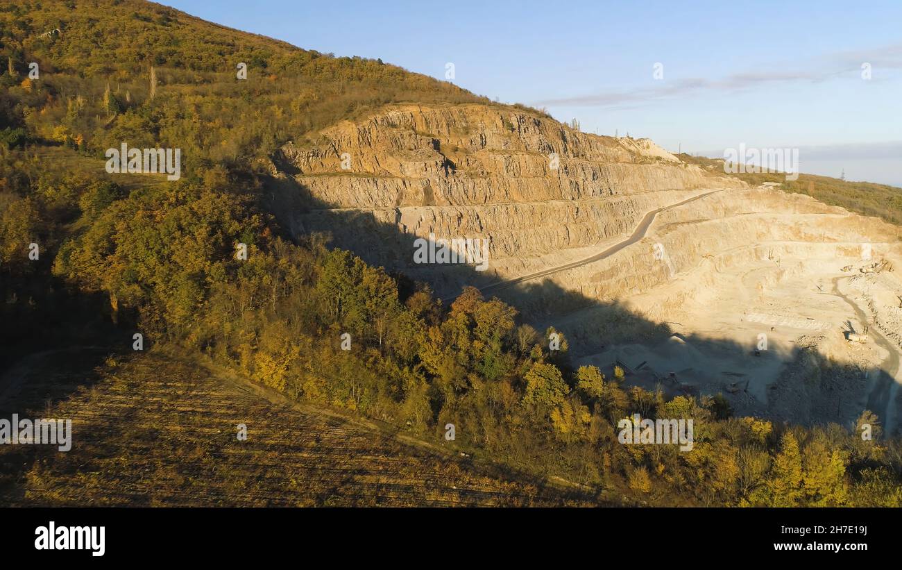 Top view of quarry with trucks. Shot. Multistage pit wall for mining ...