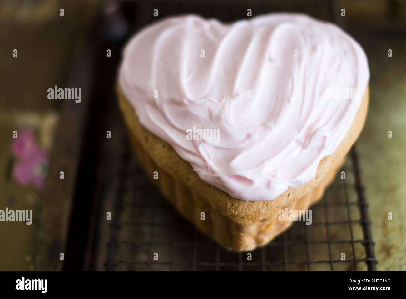 A mini heart-shaped cake with frosting Stock Photo - Alamy