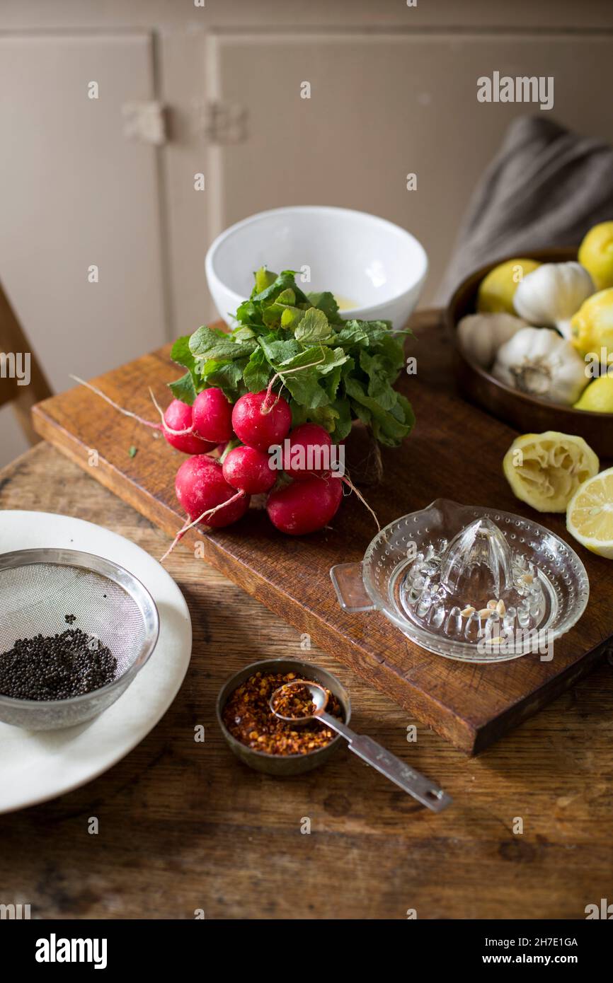 Radishes and kitchen prep Stock Photo - Alamy