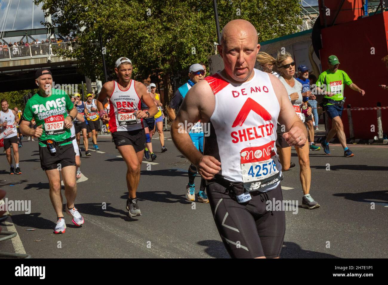 Man with bald head running and looking into the camera, Virgin Money ...
