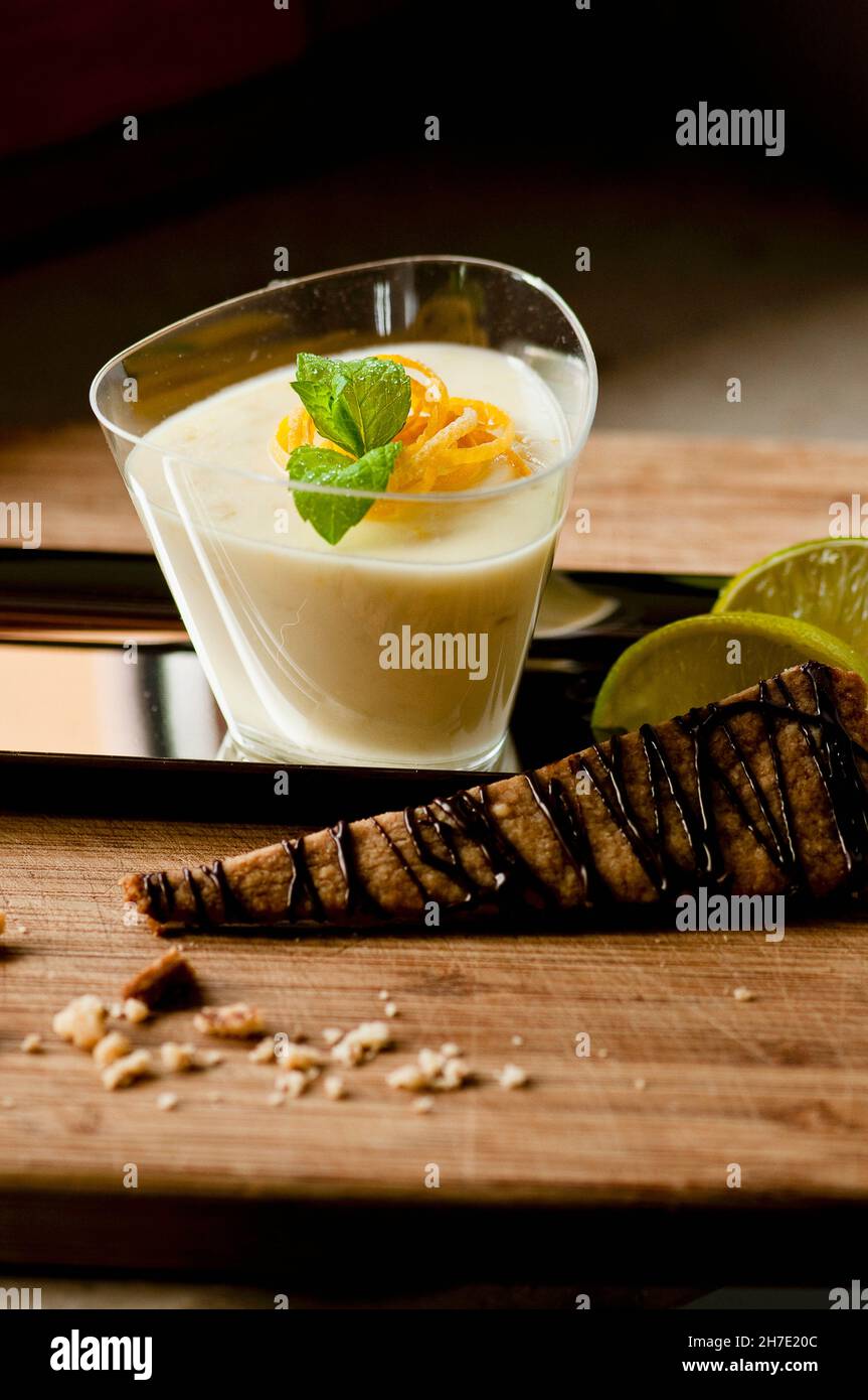 Citrus cream with chocolate biscuits Stock Photo - Alamy