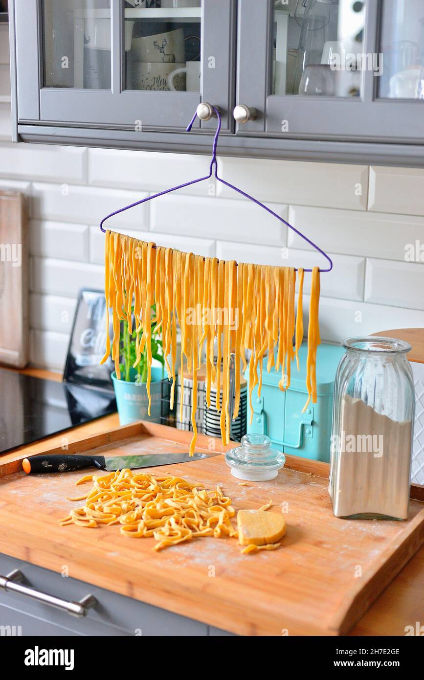 Tagliatelle pasta, drying pasta, drying pasta on a hanger Stock Photo ...