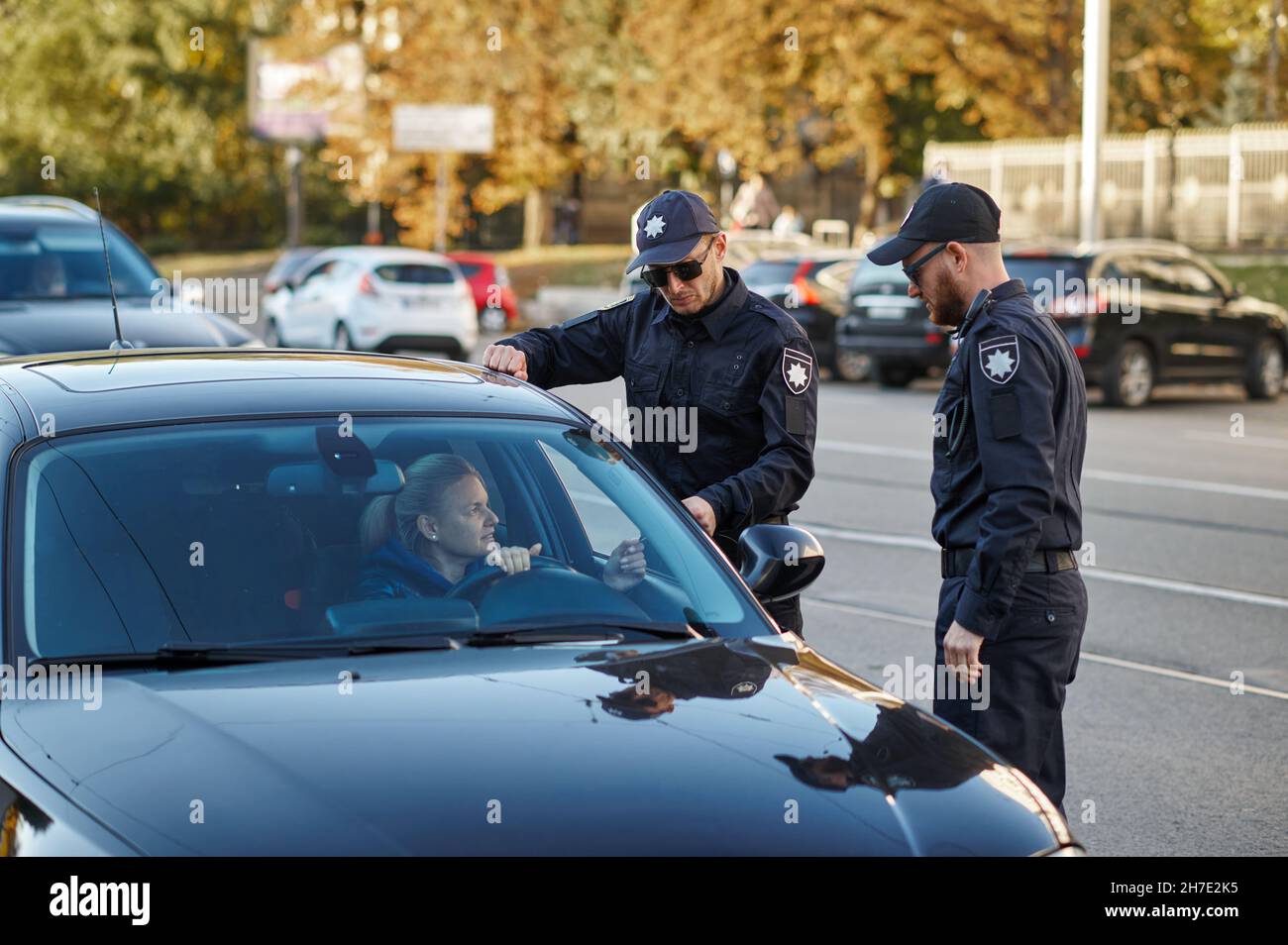 Police patrol checking female driver Stock Photo - Alamy