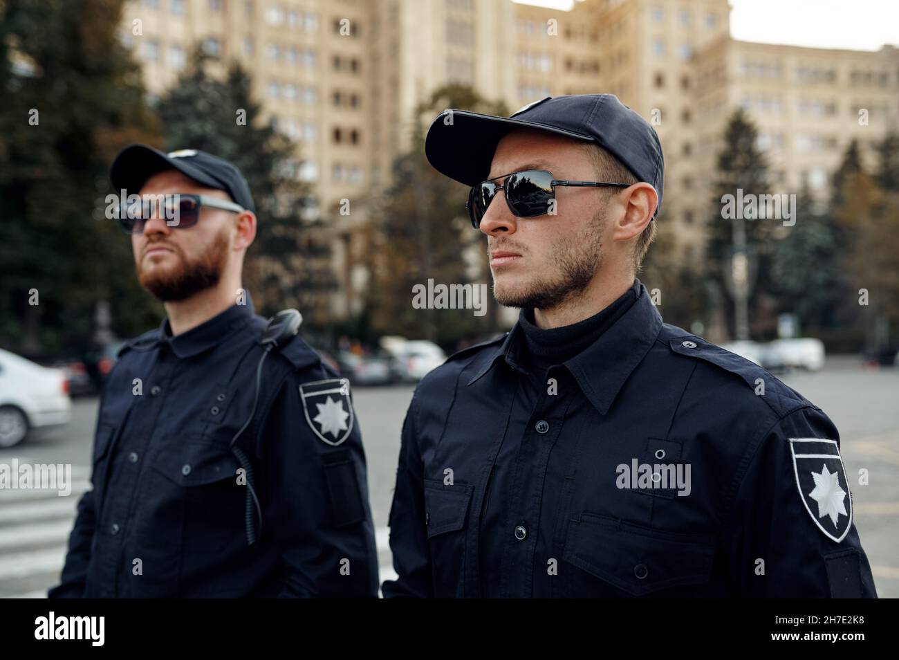 Male police officers in uniform and sunglasses Stock Photo - Alamy