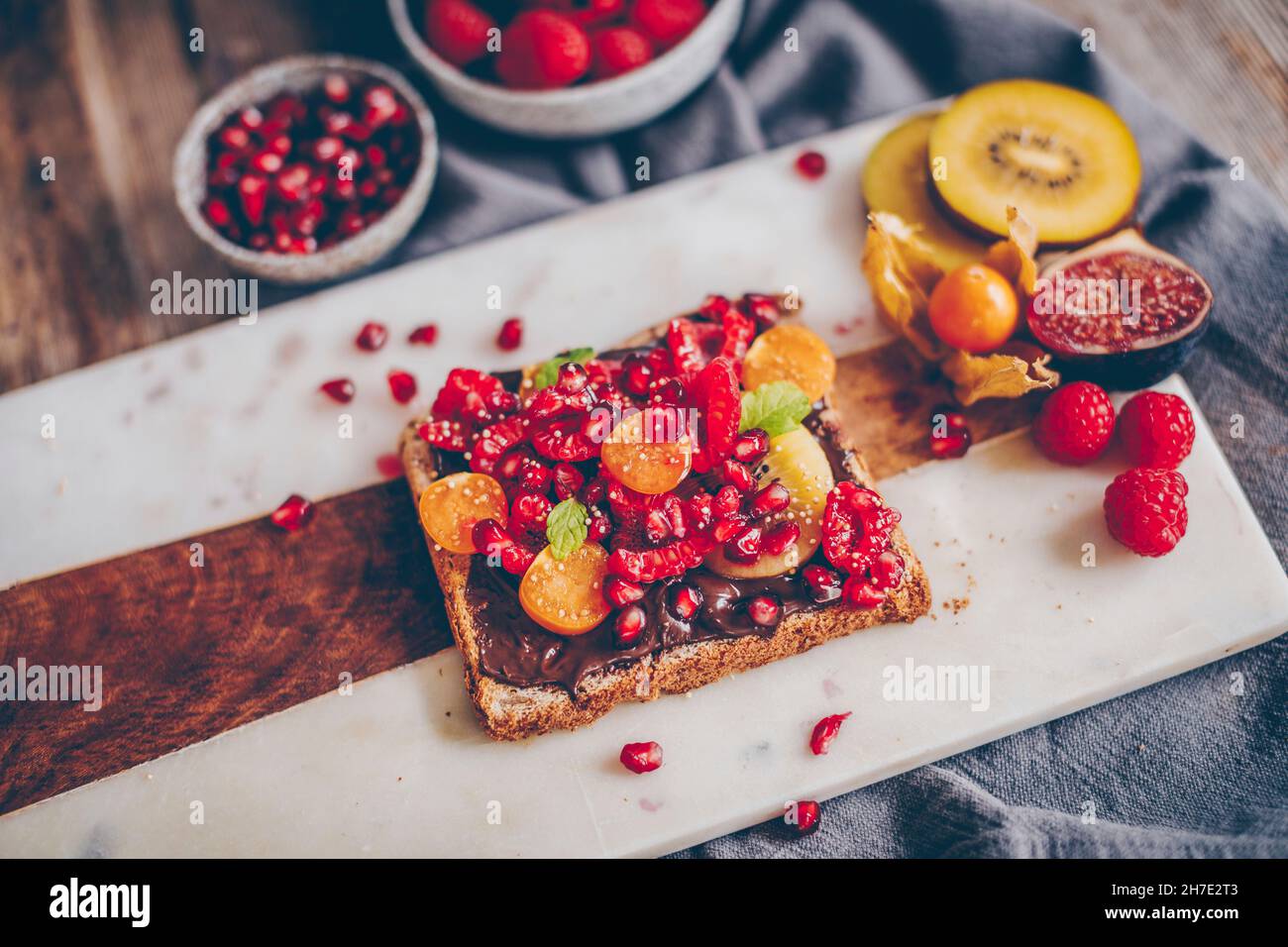 Wholemeal toast with a chocolate spread and fruit Stock Photo - Alamy
