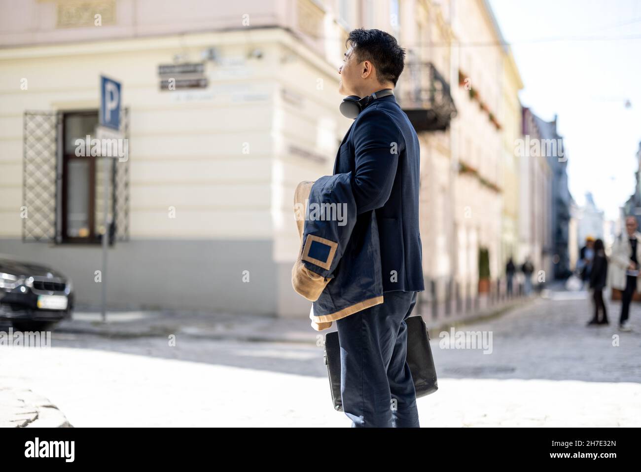 Man stand on city street and wait for someone Stock Photo - Alamy
