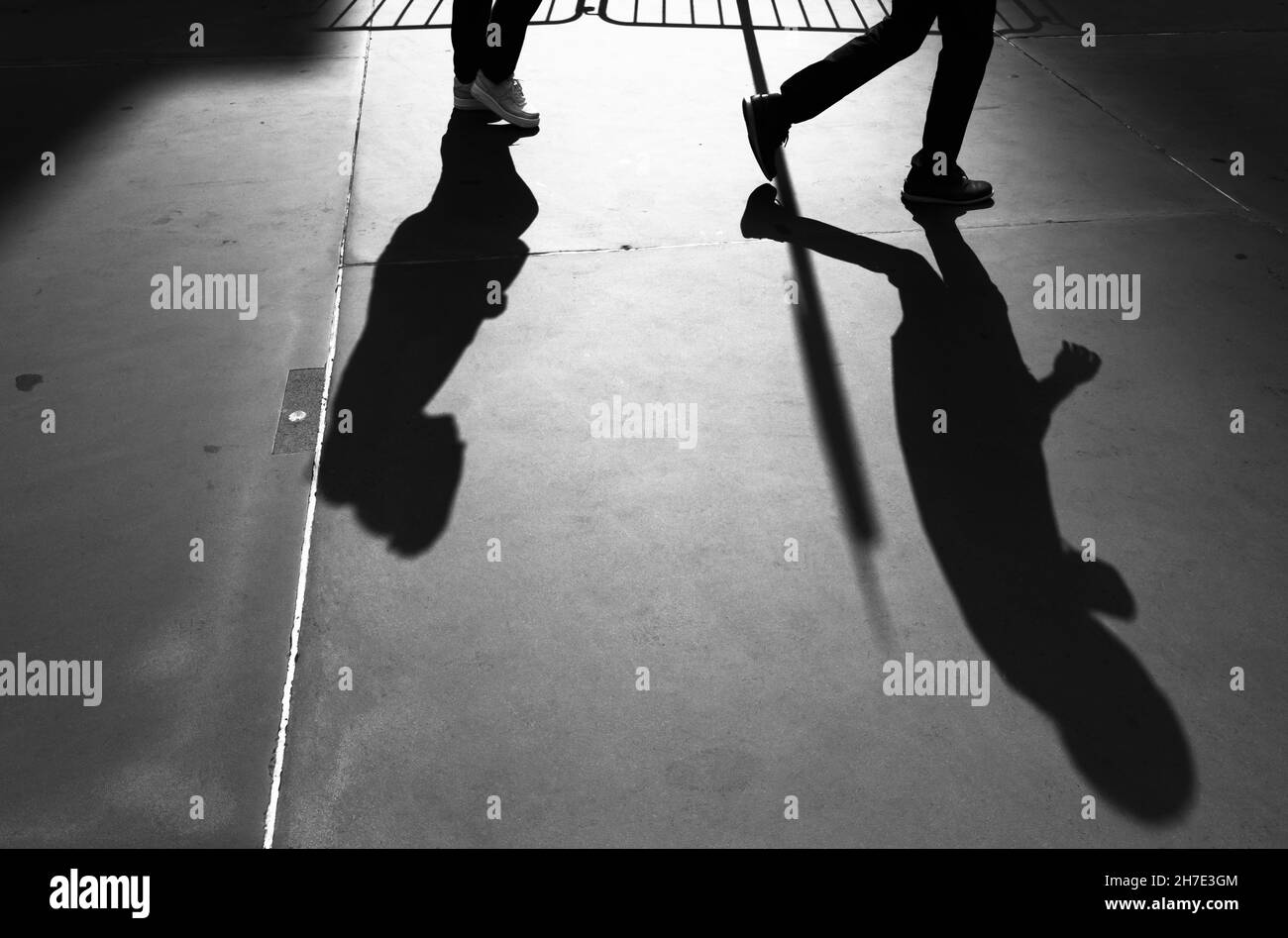 Light and shadows in New York City. Shadows of people walking street in ...