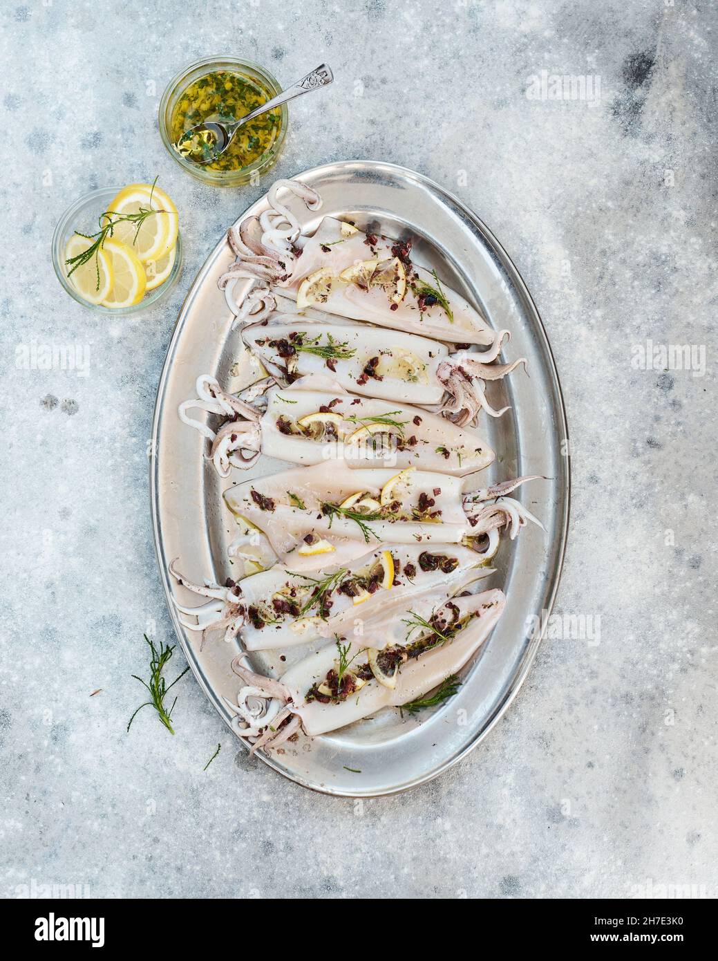 Fresh Adriatic Sea squid with lemons and marinade Stock Photo - Alamy