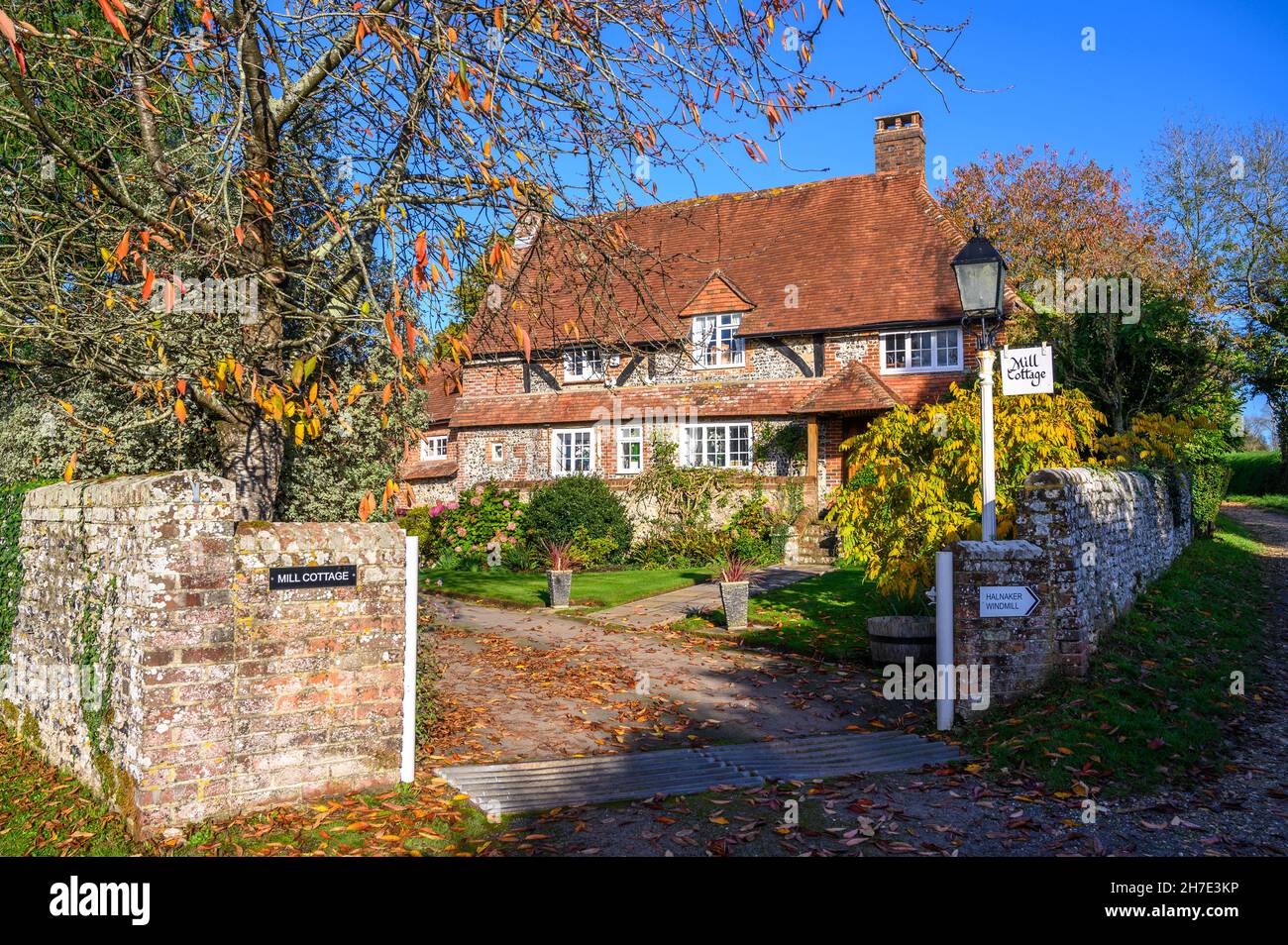 Mill Cottage, Halnaker, is an old house with brickwork and half ...