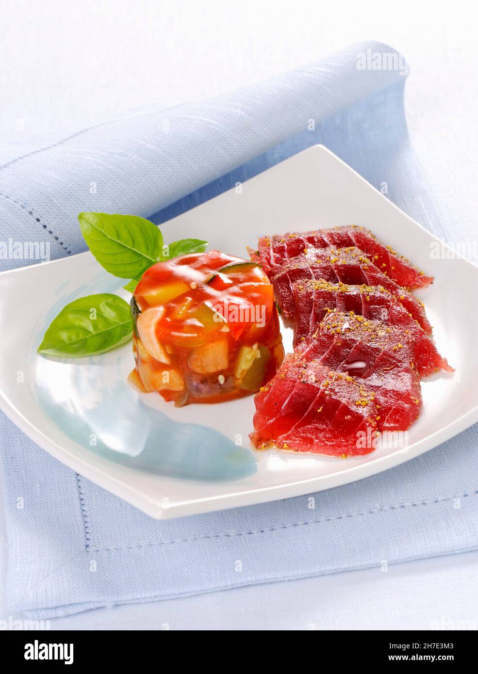 Raw tuna fish with a ratatouille jelly Stock Photo - Alamy