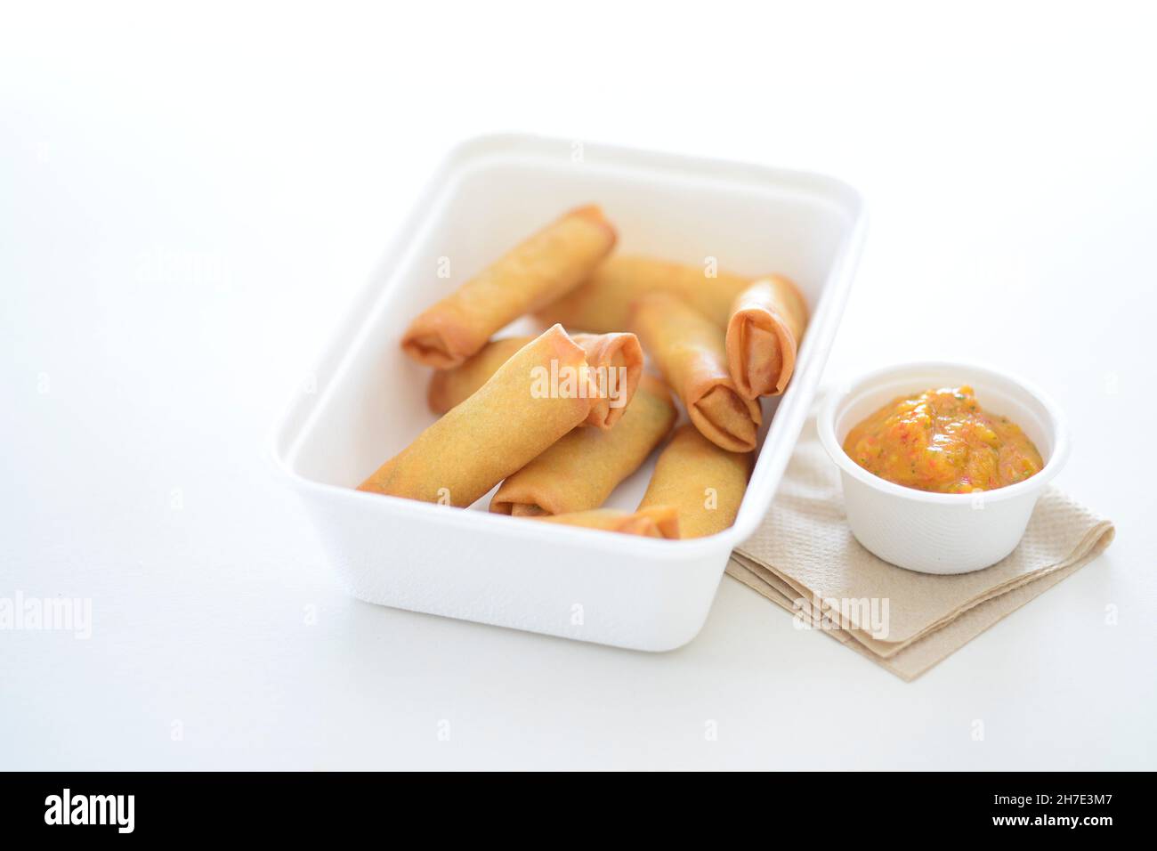 Spring rolls and a dip in take away cartons Stock Photo - Alamy