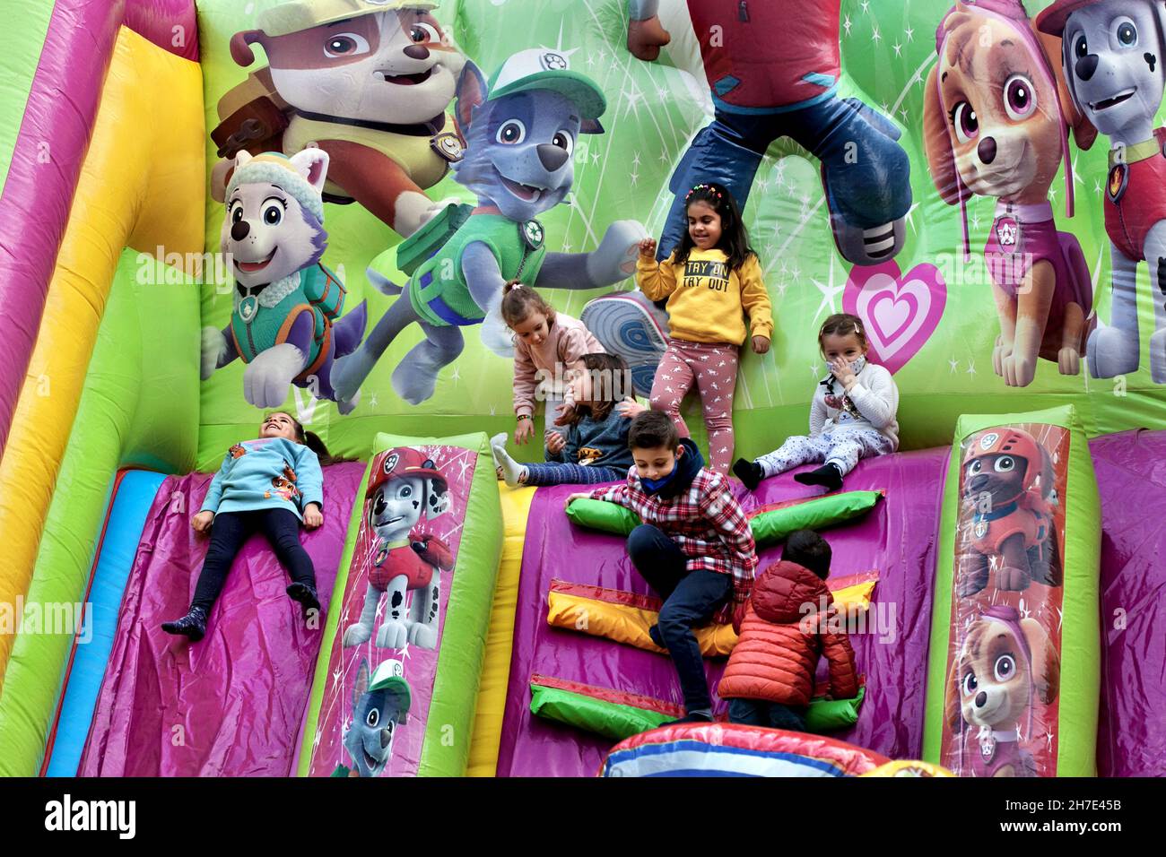 Children playing on inflatable / bouncy castle, Barcelona, Spain Stock ...